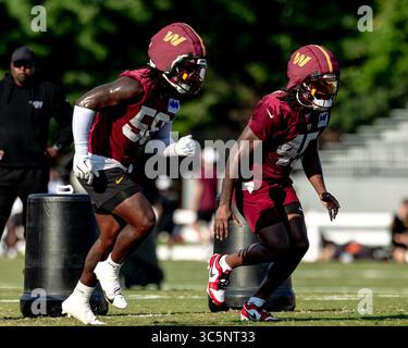Washington Commanders safety Dominique Hampton (45) tackles New England ...