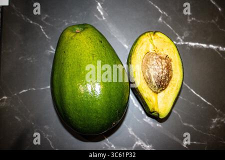 Avocado also known as Alligator Pear or Butter Fruit Stock Photo - Alamy