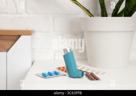 Modern inhaler on bedside table, closeup Stock Photo - Alamy