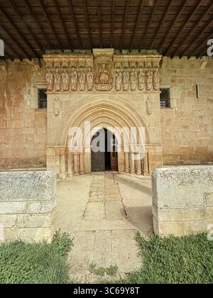 Romanesque church portal featuring multiple arches and sculpted figures ...