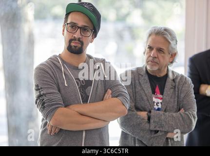 Lin-Manuel Miranda (l) and his father Luis Miranda Jr. (c) pose next to ...