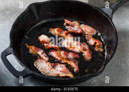 Greasy Fatty Cooked Crispy Bacon in a Skillet Stock Photo - Alamy