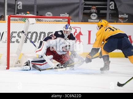 Nashville Predators left wing Cole Smith (36) skates the puck past ...