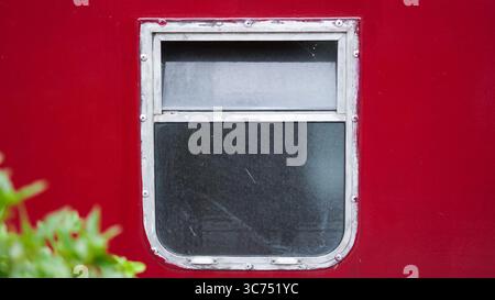 Old boat window closeup with signs of weathering and saltwater maritime ...