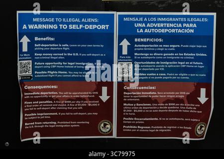 Federal immigration agents work on the scene in Minneapolis, Sunday ...