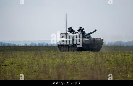 close-up of Commander and gunner directing a British army FV4034 ...