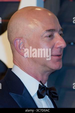 Amazon founder Jeff Bezos, center, stands with Miami Mayor Francis ...