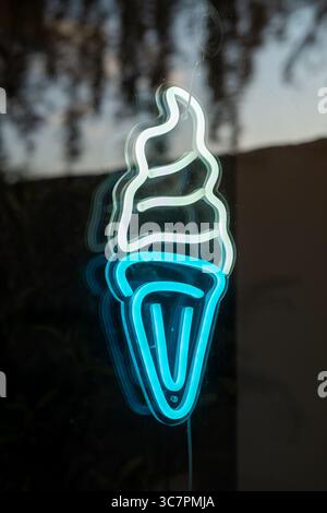 Storefront of CREAM ice cream shop with blue and yellow facade, open ...