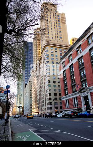 Modern architectural building with tree-lined terraces under a blue sky. Shanghai, China Stock ...