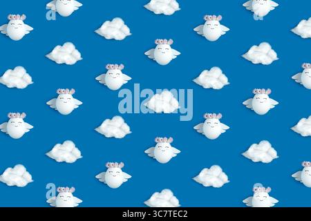 White cotton cloud with Easter eggs on blue background. Minimal spring ...