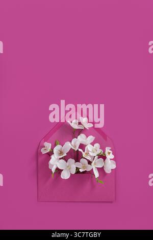 Creative layout with blooming apple tree on a blue background. Flat lay ...