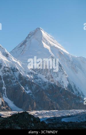 A vertical shot of a mountain peak under a cloudy sky Stock Photo - Alamy