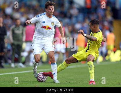 Brenden Aaronson of Leeds United is tackled by Casemiro of Manchester ...