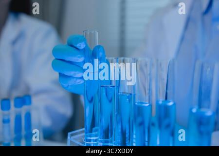 Two chemists working in lab experimenting Stock Photo - Alamy