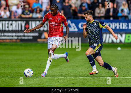 Kallum Cesay of Salford City FC under pressure from Freddy Willcox and ...
