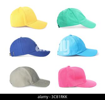 Baseball caps in different colors and stacked clothes isolated on white ...