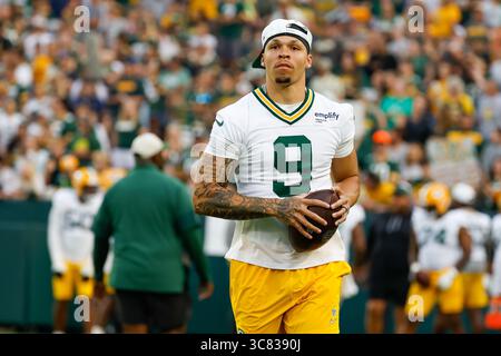 Green Bay Packers' Christian Watson runs in for a touchdown against the ...