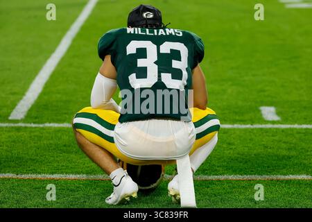 Green Bay Packers safety Evan Williams (33) celebrates the victory ...