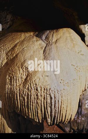 A big stalactite is hanging from the rock Stock Photo - Alamy