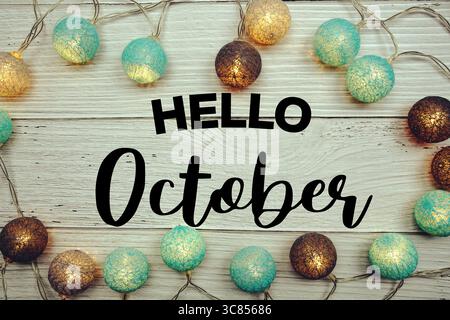 Hello October text message with LED cotton ball decoration on wooden ...