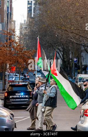 Protesters with Australian flags march to State Parliament during the ...