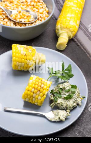 An ear of boiled corn in a paper cup. Fast food concept Stock Photo - Alamy