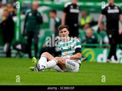 Celtic's Kieran Tierney goes down after jostling for position with ...