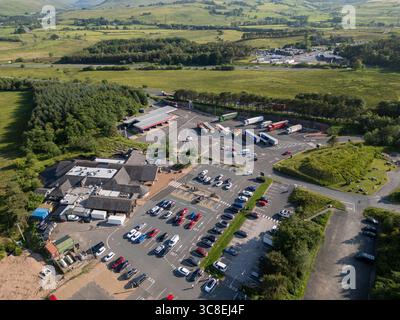 Aerial, Tebay Services, Cumbria, parked lorries and cars at the ...