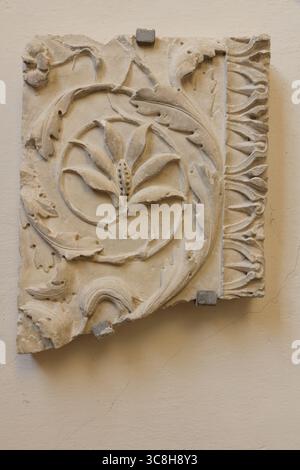 A stylized sculpture of a figure draped in flowing garments, exuding an ...