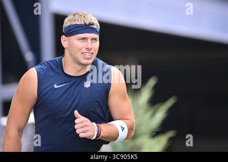 Efton Chism III #86 of the New England Patriots tackled by Jaylan Ford ...