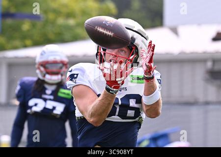 Efton Chism III #86 of the New England Patriots tackled by Jaylan Ford ...