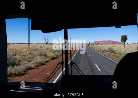 Uluru from the tourist bus. In Kata Tjuṯa National Park in the Northern ...