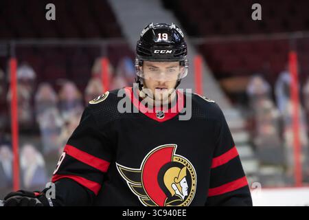 Ottawa Senators' Drake Batherson (19) cross-checks Detroit Red Wings ...