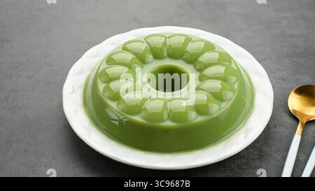 Matcha pudding dessert with strawberry topping Stock Photo - Alamy