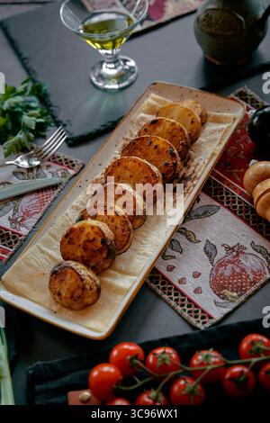 Appetizing grilled eggplant slices served in white bowl. Fresh ...