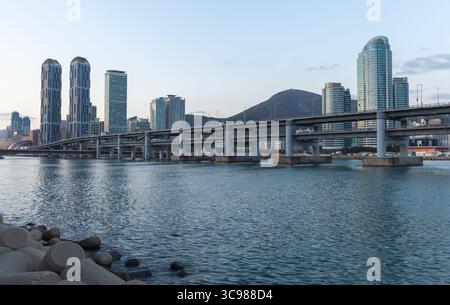 Busan coastal urban landscape featuring namhang bridge spanning the bay ...