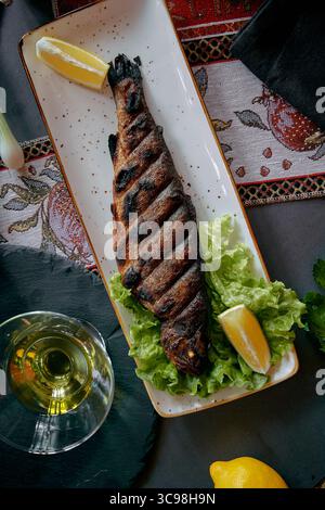 Deliciously Grilled Fish Served With Fresh Greens and Vibrant Flavors ...