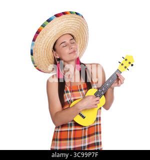 Young beautiful hispanic woman playing classical guitar sitting on sofa ...