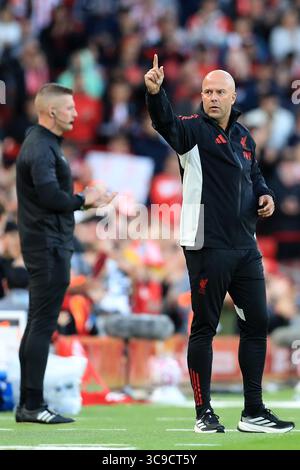 Liverpool manager Arne Slot gestures on the touchline during the ...