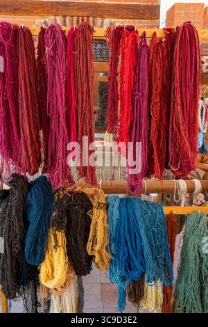 Colorful skeins of wool yarn to be used in weaving rugs in Teotitlan ...