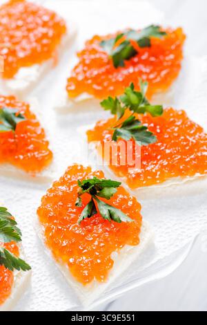 sandwiches with red caviar. selective focus. valuable food product, has ...