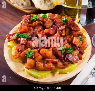 Morro de cerdo a la gallega - spanish dish. Roast nose and cheek pigs ...