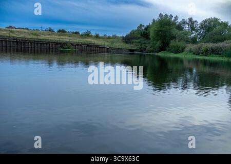 Reflective surface of a river under the blue sky Stock Photo - Alamy
