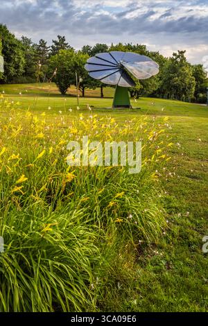 Rotating solar panel in flower shape in a city park. Photovoltaic ...