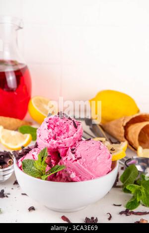 Hibiscus organic ice cream with waffle on stone plate with spoon and ...