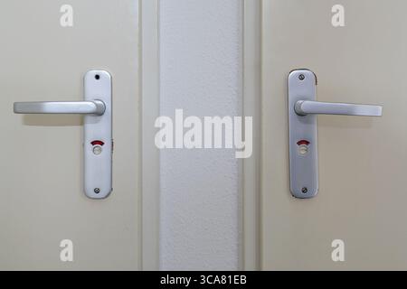 bathroom door handle showing occupied Stock Photo - Alamy
