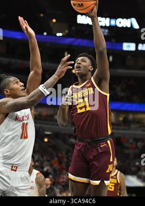 Maryland forward Pharrel Payne (21) is helped off the court by guard ...