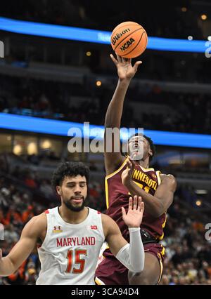 Maryland forward Pharrel Payne (21) is helped off the court by guard ...