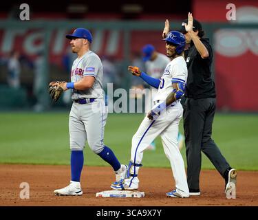 Kansas City Royals' Samad Taylor (0) and Salvador Perez (13) celebrate ...
