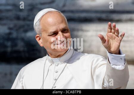 Pope Leo XIV waves as he arrives for his weekly general audience in St ...